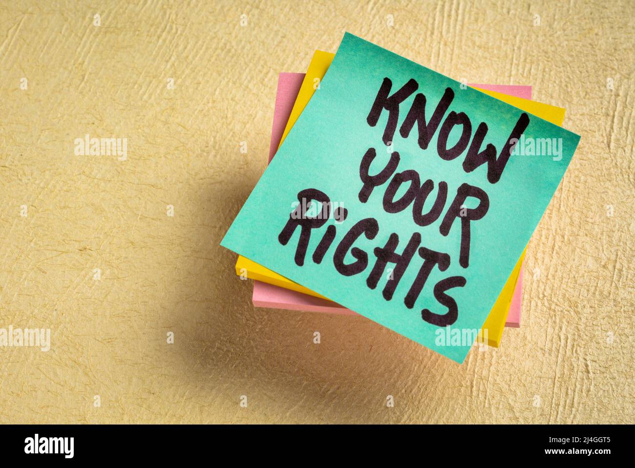 Know your rights reminder, handwriting on a sticky note, legal concept ...