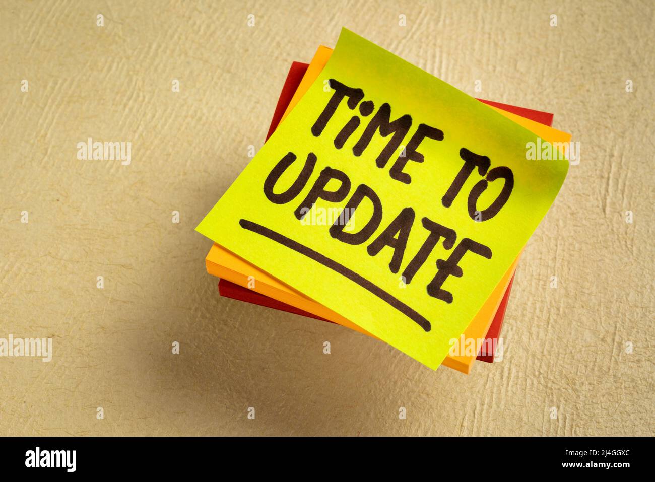 time to update - handwriting on a sticky reminder note, marketing and ...