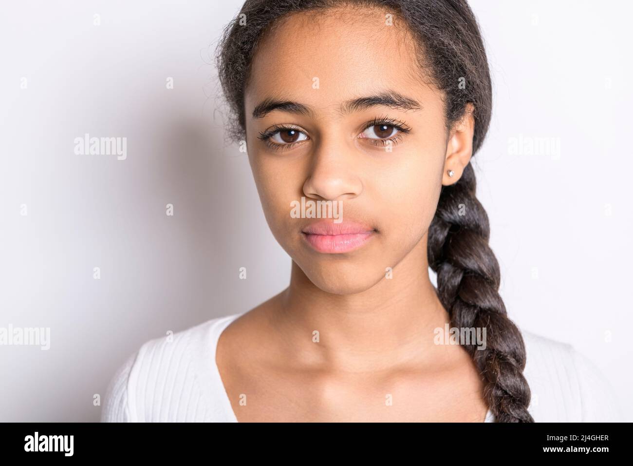 Beautiful black teen posing on studio white background looking sad ...