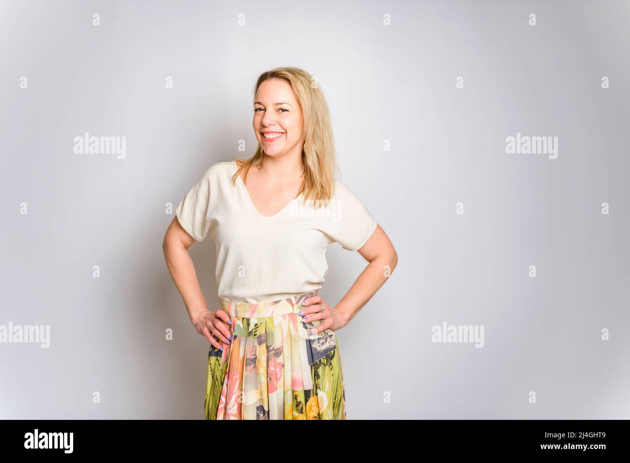 Portrait of happy 40 woman over white background Stock Photo - Alamy