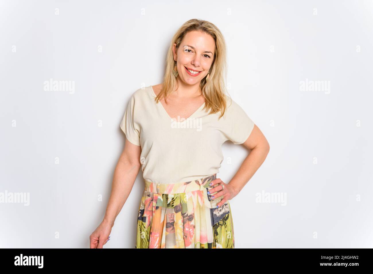 Portrait of happy 40 woman over white background Stock Photo - Alamy