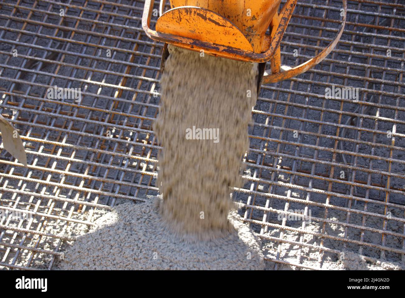 Filling up a foundation with concrete through a silo Stock Photo - Alamy