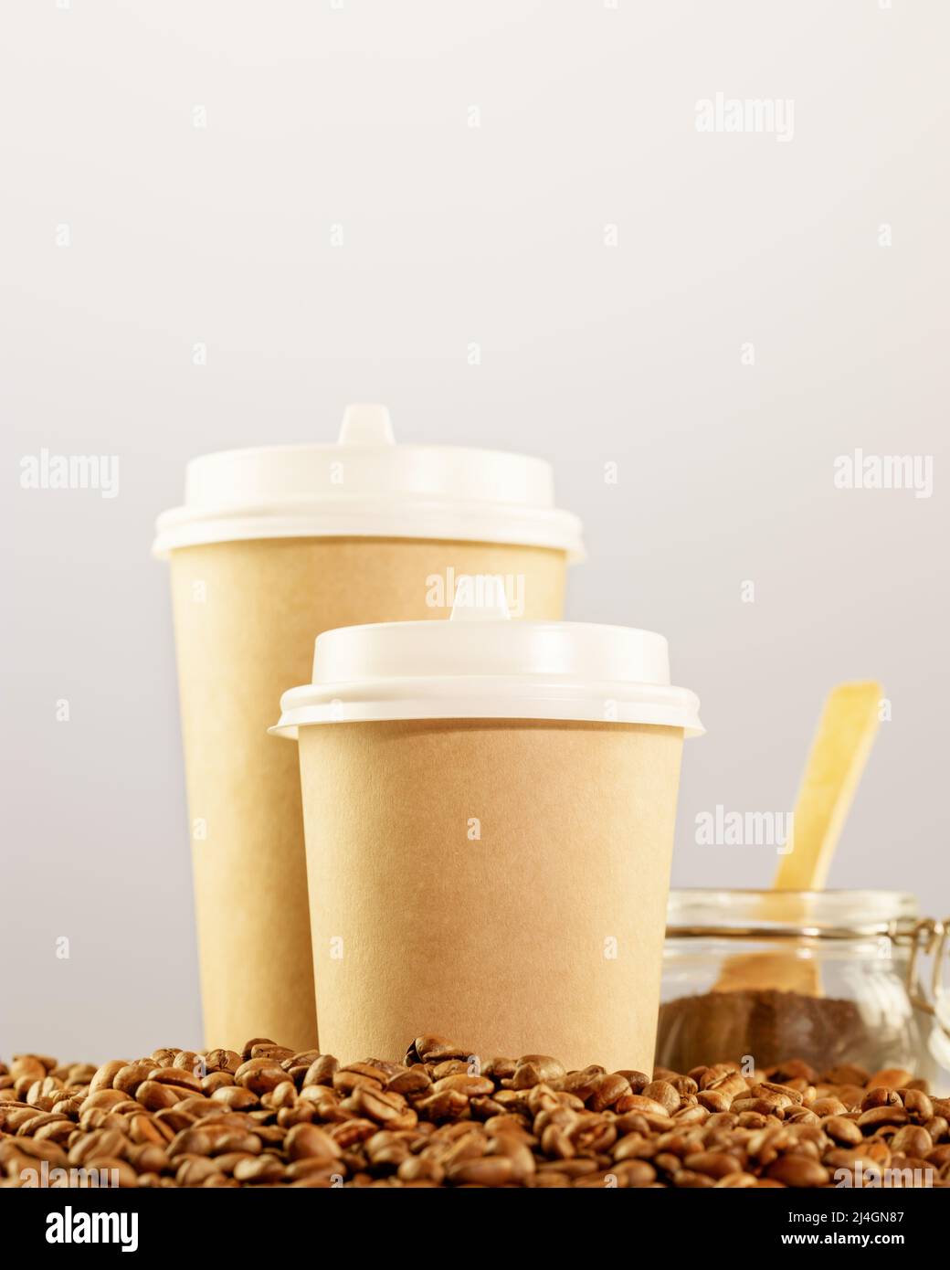 Coffee to go. Two disposable eco-friendly cardboard cups on a natural ...