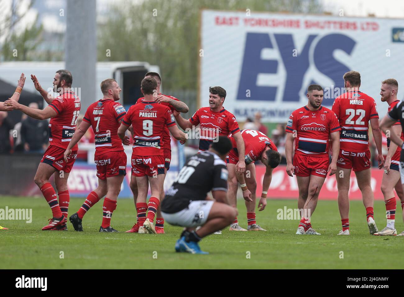 Hull KR players celebrate while Chris Satae #10 of Hull FC shows total ...