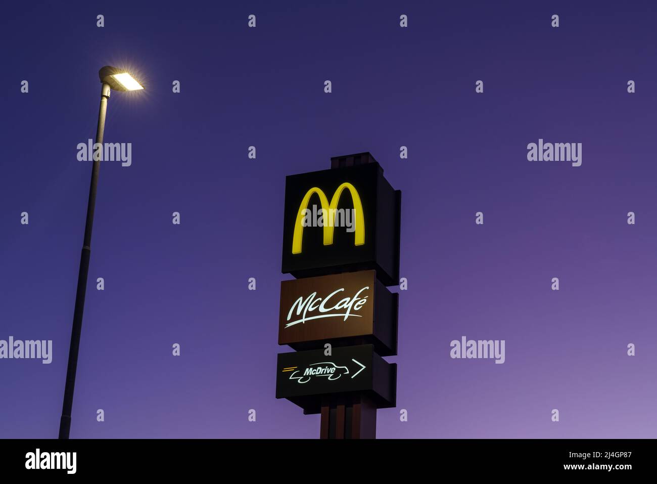 McDonald's and McCafe logos outside fast-food hamburger restaurant at ...