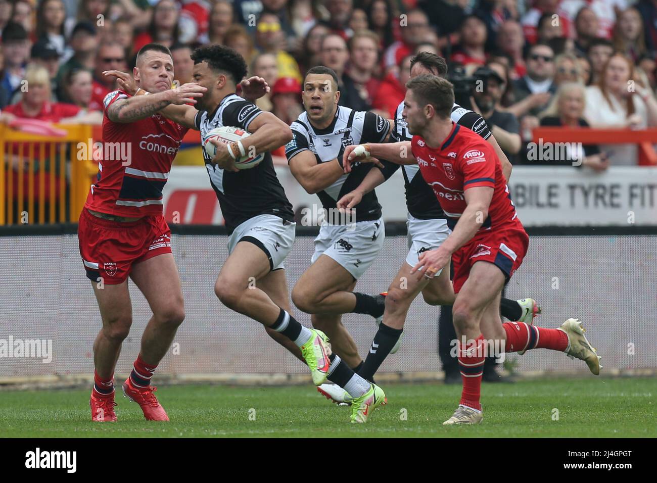 Shaun Kenny-Dowall #4 of Hull KR looks to tackle Darnell McIntosh #5 of ... Shaun Kenny-Dowall #4 of Hull KR looks to tackle Darnell McIntosh #5 of ...