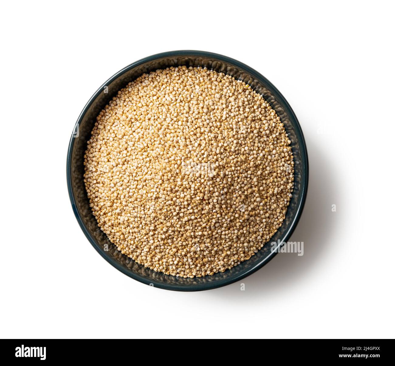 White quinoa seeds in a blue ceramic bowl isolated on a white ...