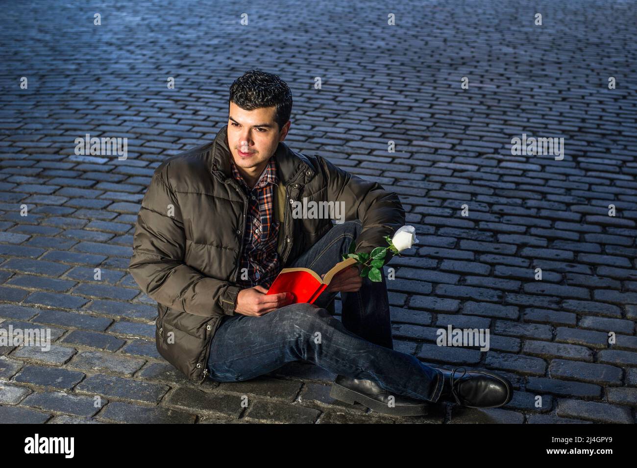 Hispanic man reading book outside hi-res stock photography and images ...