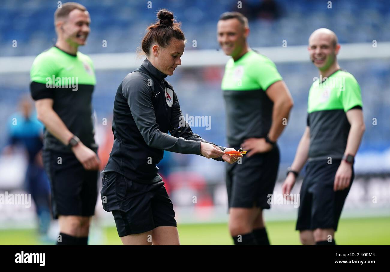Fourth official Rebecca Welch uses red and yellow cards to take a Bee ...
