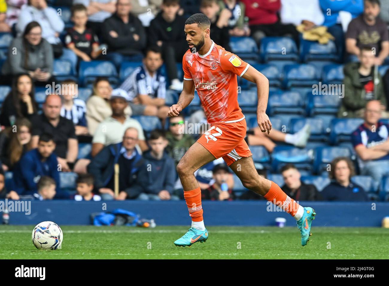 CJ Hamilton #22 of Blackpool makes a break with the ball Stock Photo ...