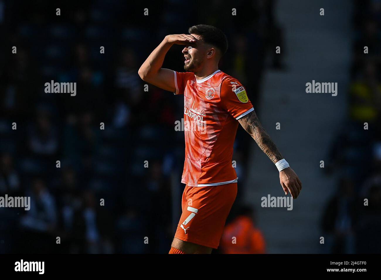 Owen Dale #7 of Blackpool shields his eyes from the sun during the game ...