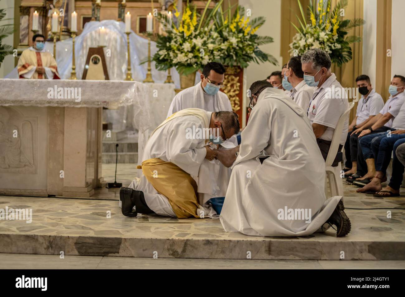 People attend the Sacrament of Eucharist Mass during the holy week ...