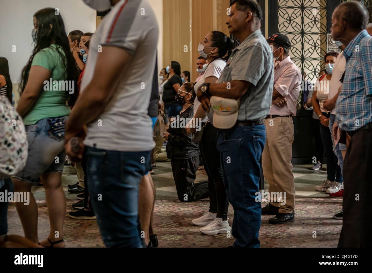 People attend the Sacrament of Eucharist Mass during the holy week ...