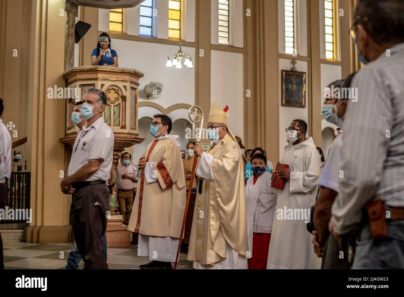 People attend the Sacrament of Eucharist Mass during the holy week ...