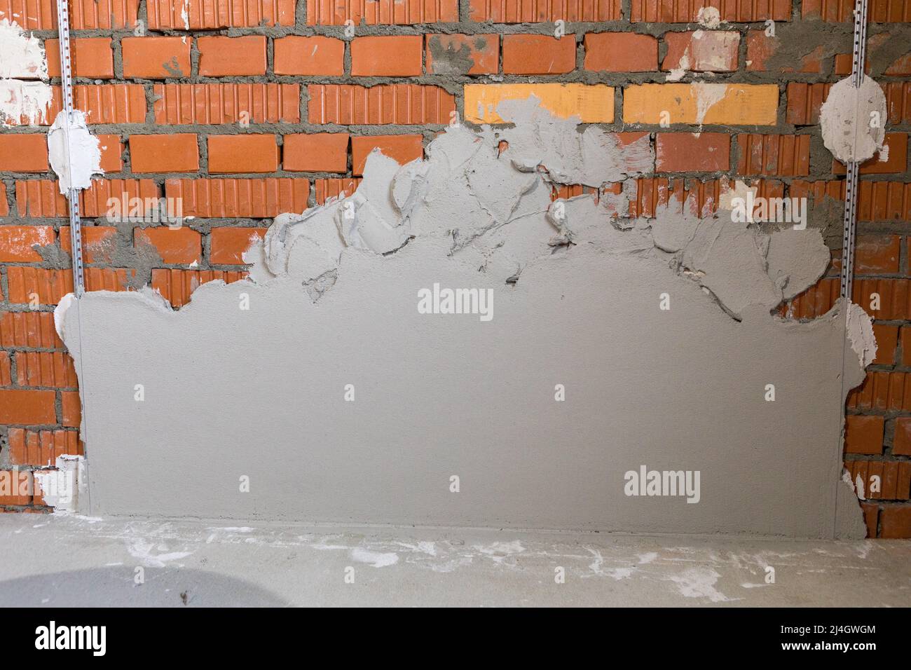 Industrial background. Structural plaster on the wall. Brick wall with ...
