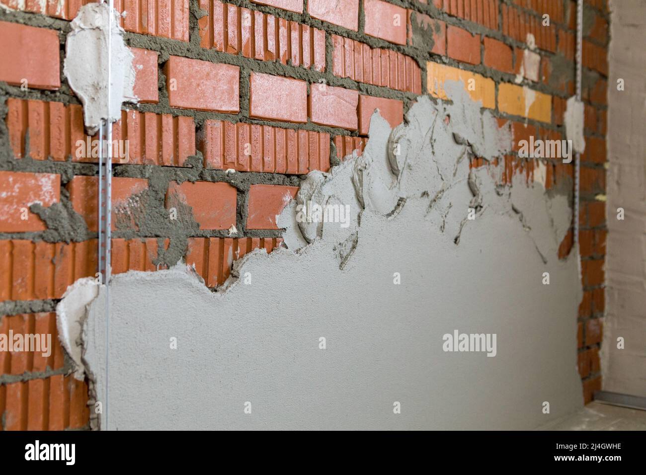 Industrial background. Structural plaster on the wall. Brick wall with ...