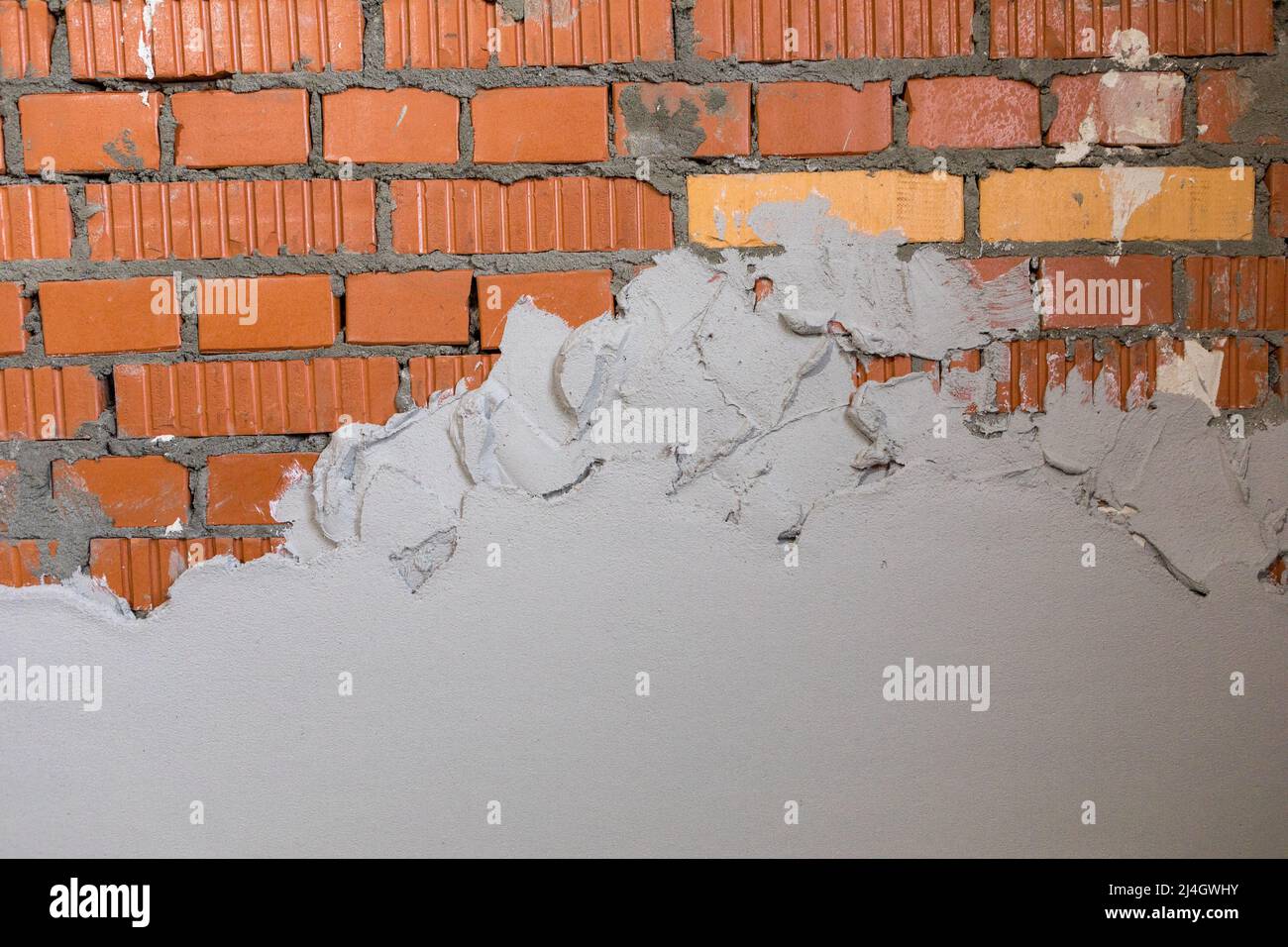 Industrial background. Structural plaster on the wall. Brick wall with ...