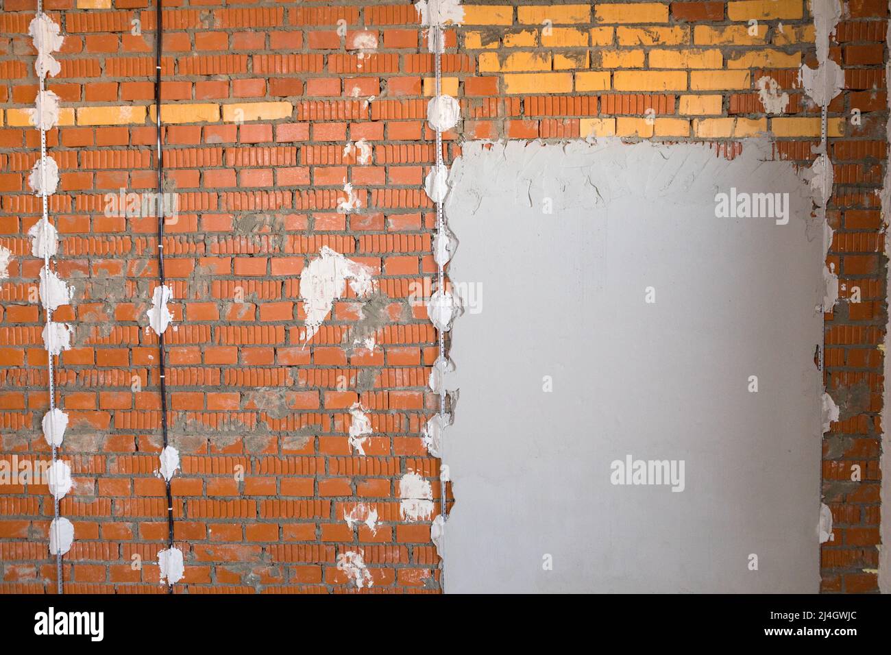 Industrial background. Structural plaster on the wall. Brick wall with ...