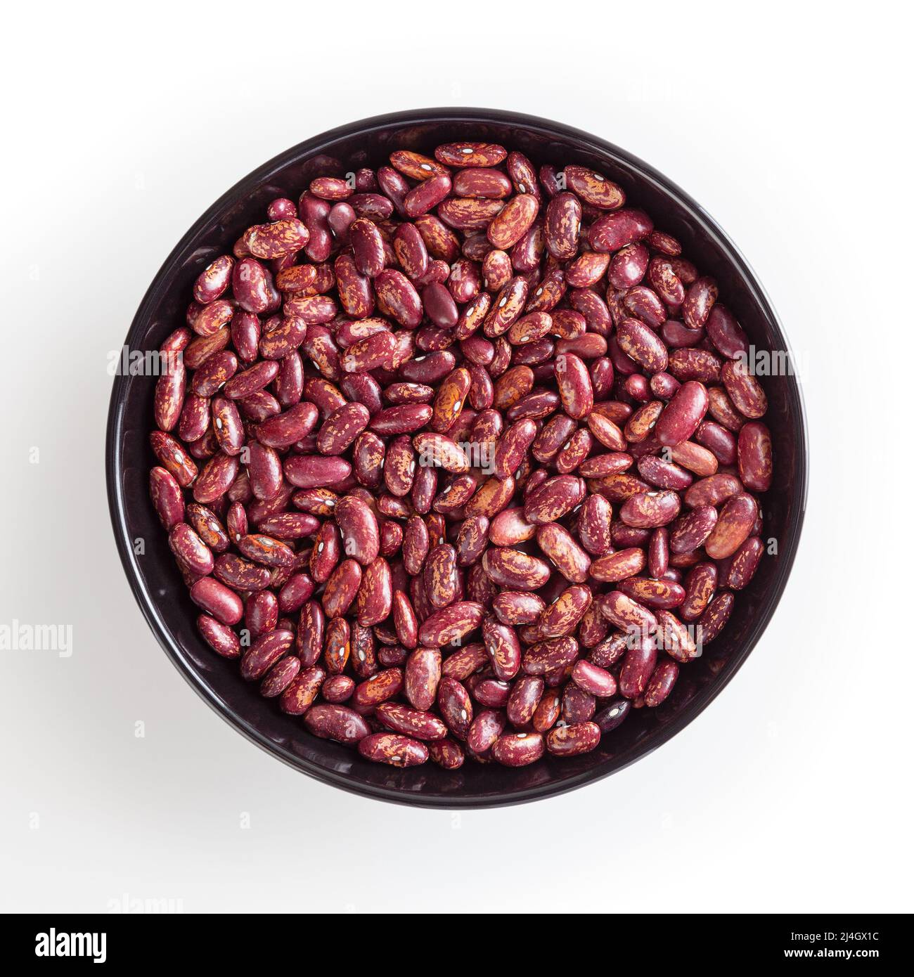 Red pinto beans in black bowl isolated on white background with ...