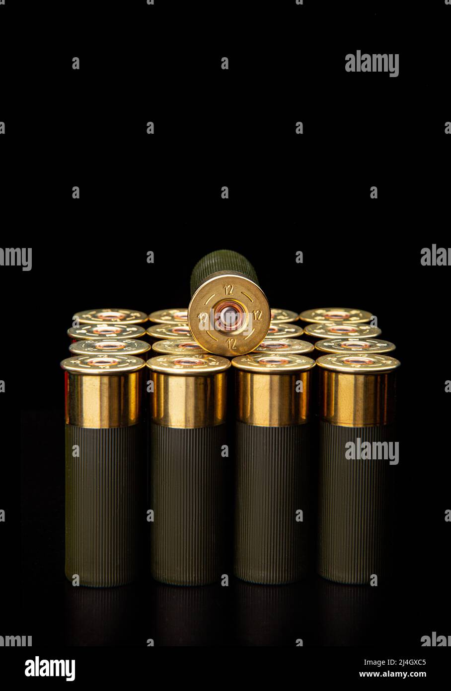 Shotgun shells on a black reflective surface. Ammunition for 12 gauge ...