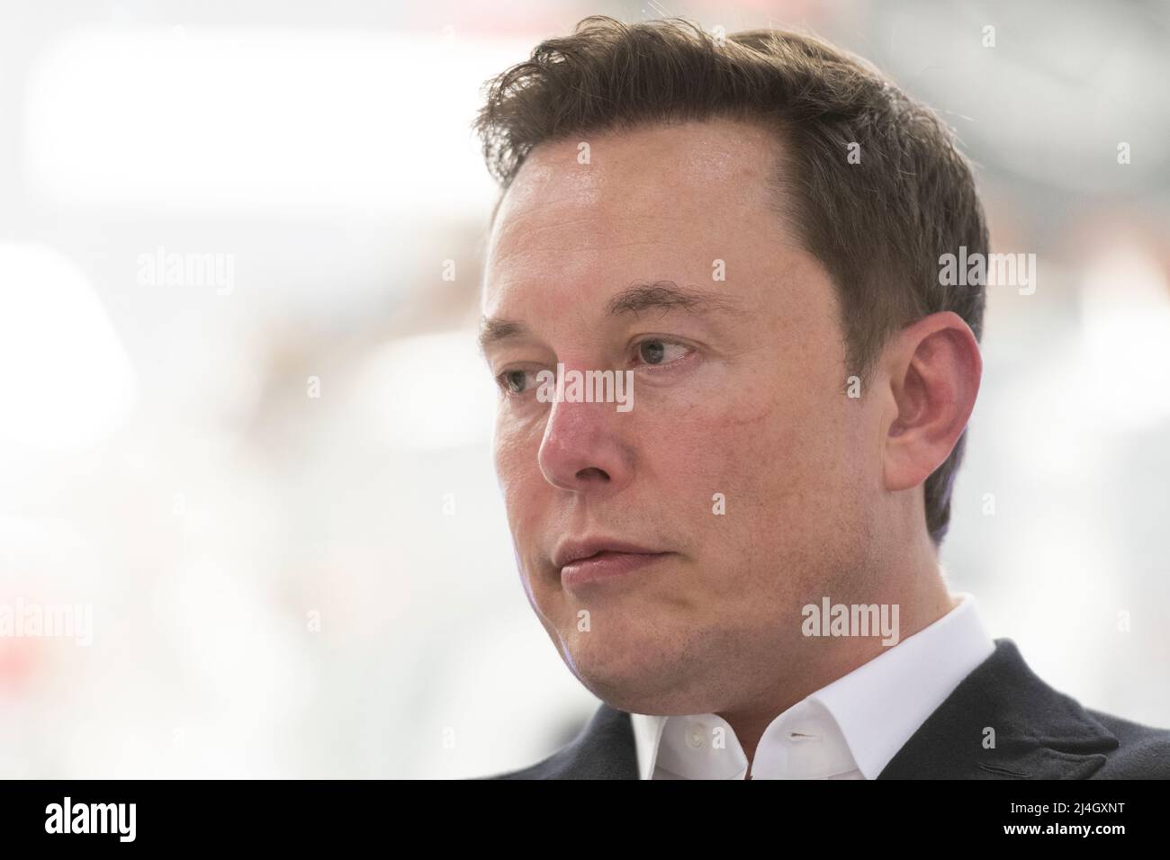 SpaceX Chief Engineer Elon Musk speaks to media in front of Crew Dragon ...