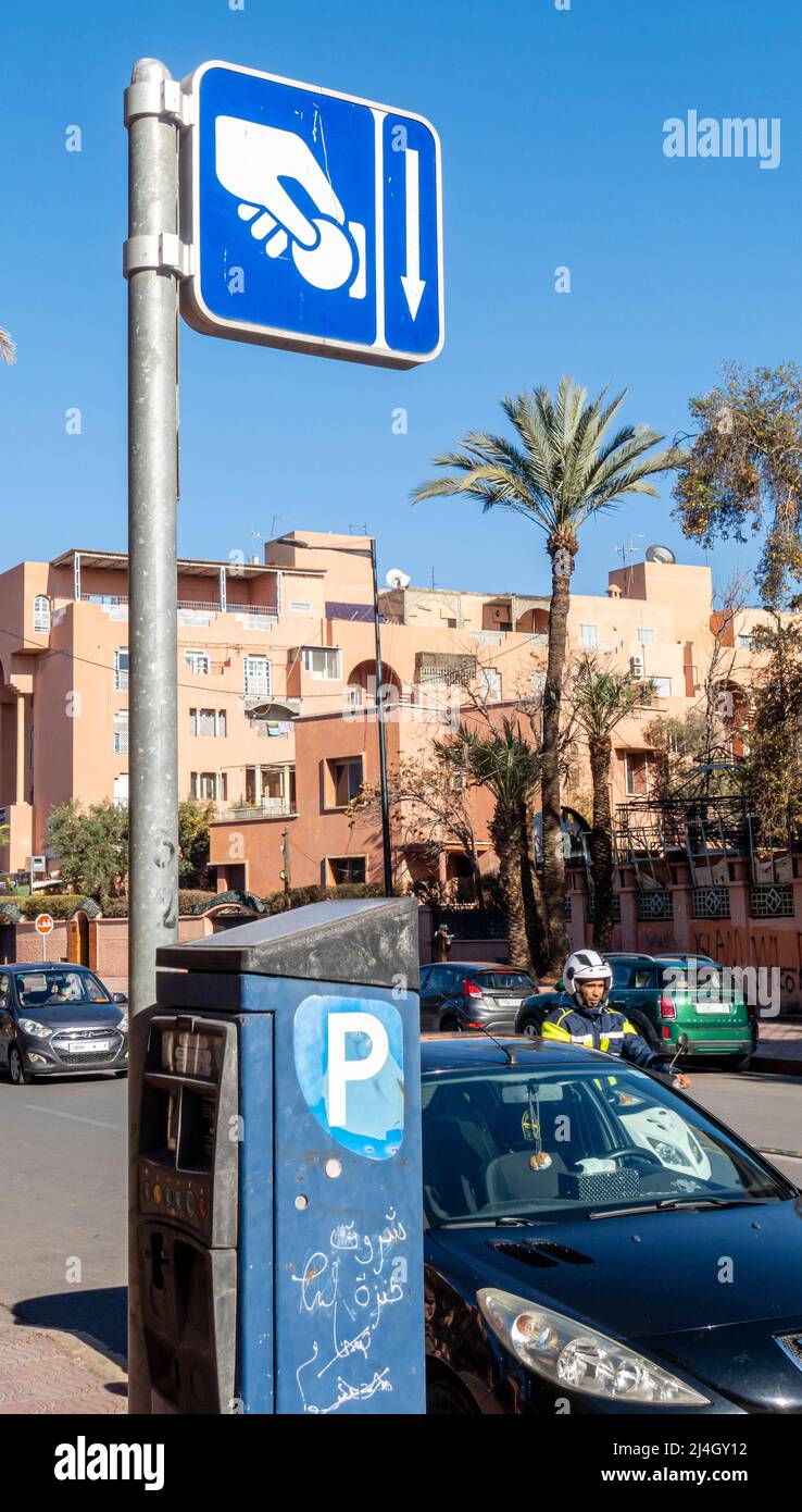 Parking payment sign and booth in the street of Marrakech, Morocco ...