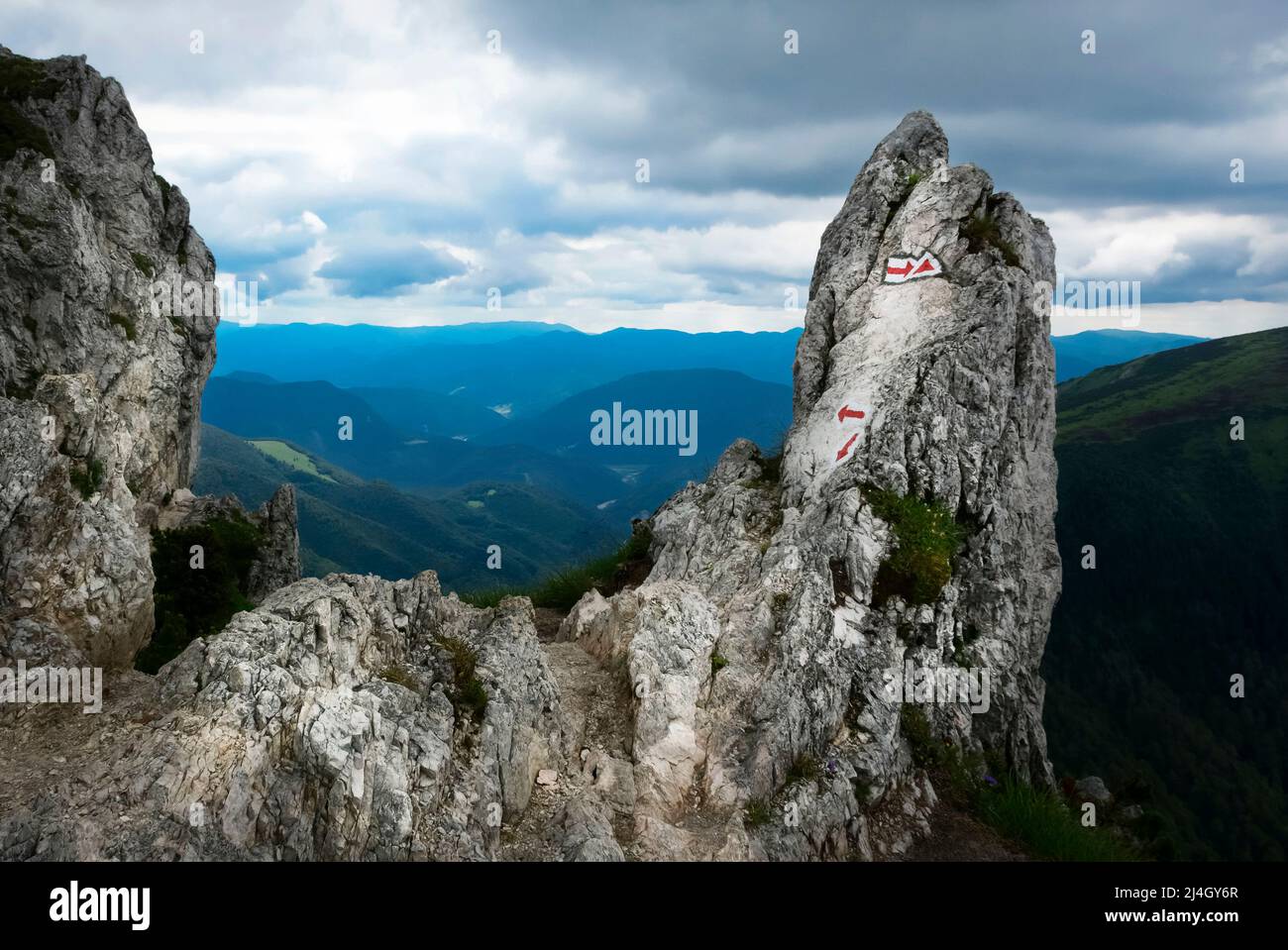 landscape background of red hiking signs on a rock Stock Photo - Alamy