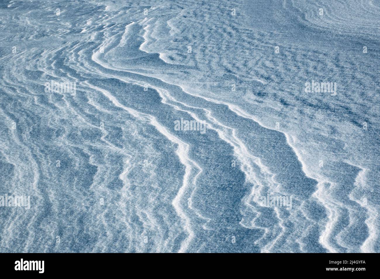 abstract background ripples on the blowing snow Stock Photo - Alamy
