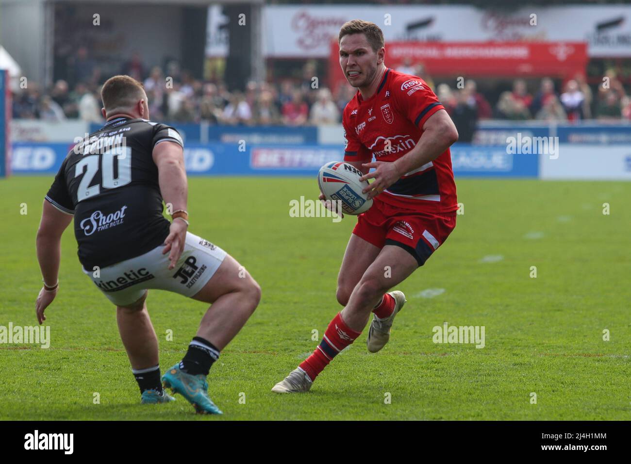 Matt Parcell #9 of Hull KR runs at Jack Brown #20 of Hull FC Stock ...