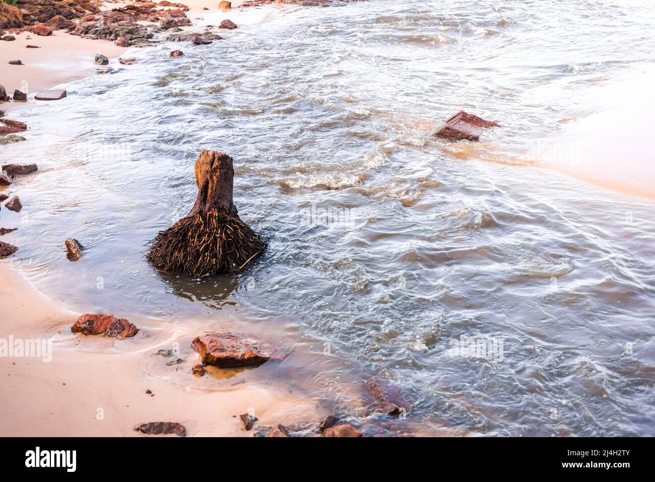 View of the river that flows into Boca do Rio beach in Salvador in the ...