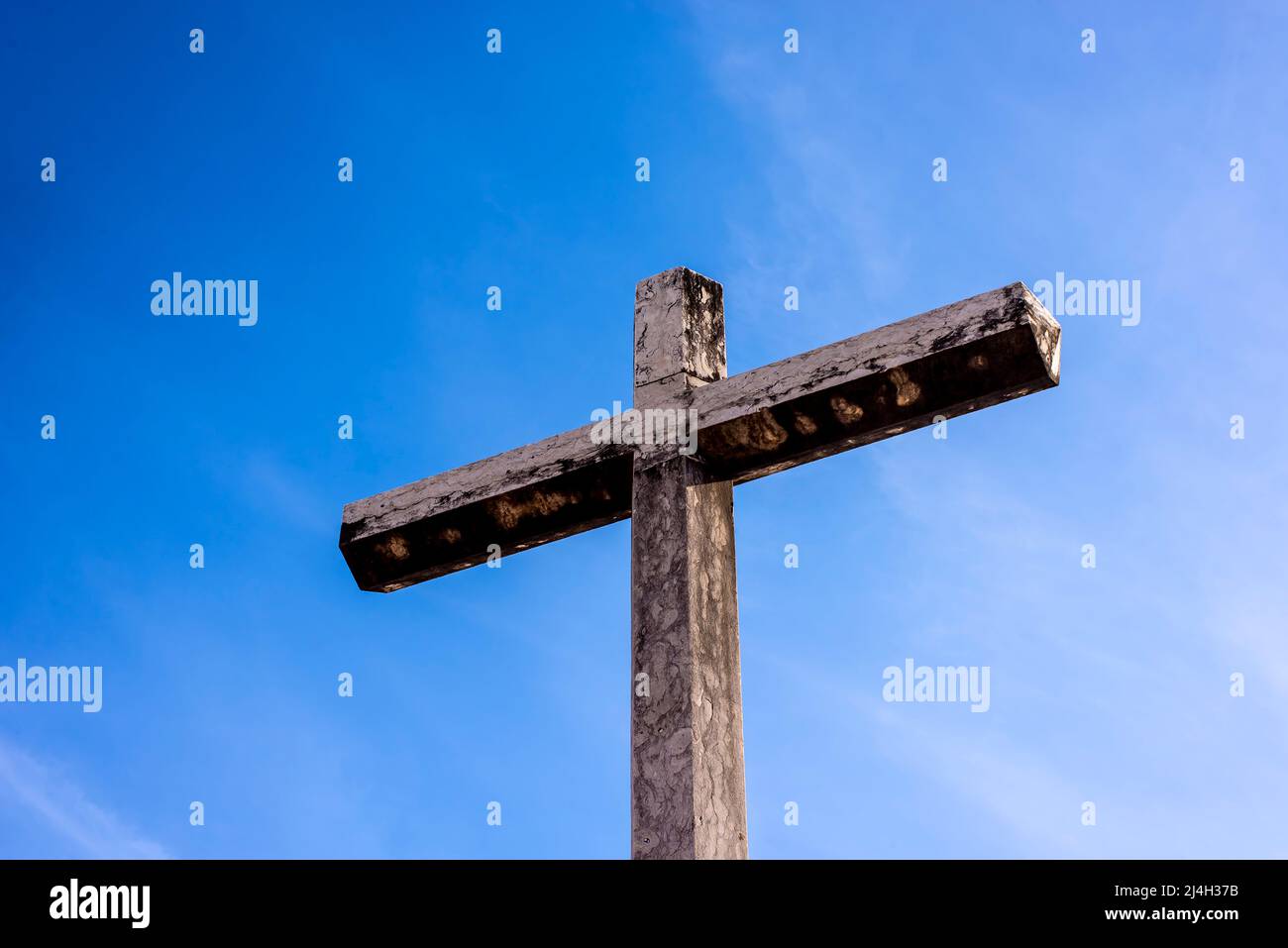 Catholic church cement cross against blue sky. City of Salvador ...