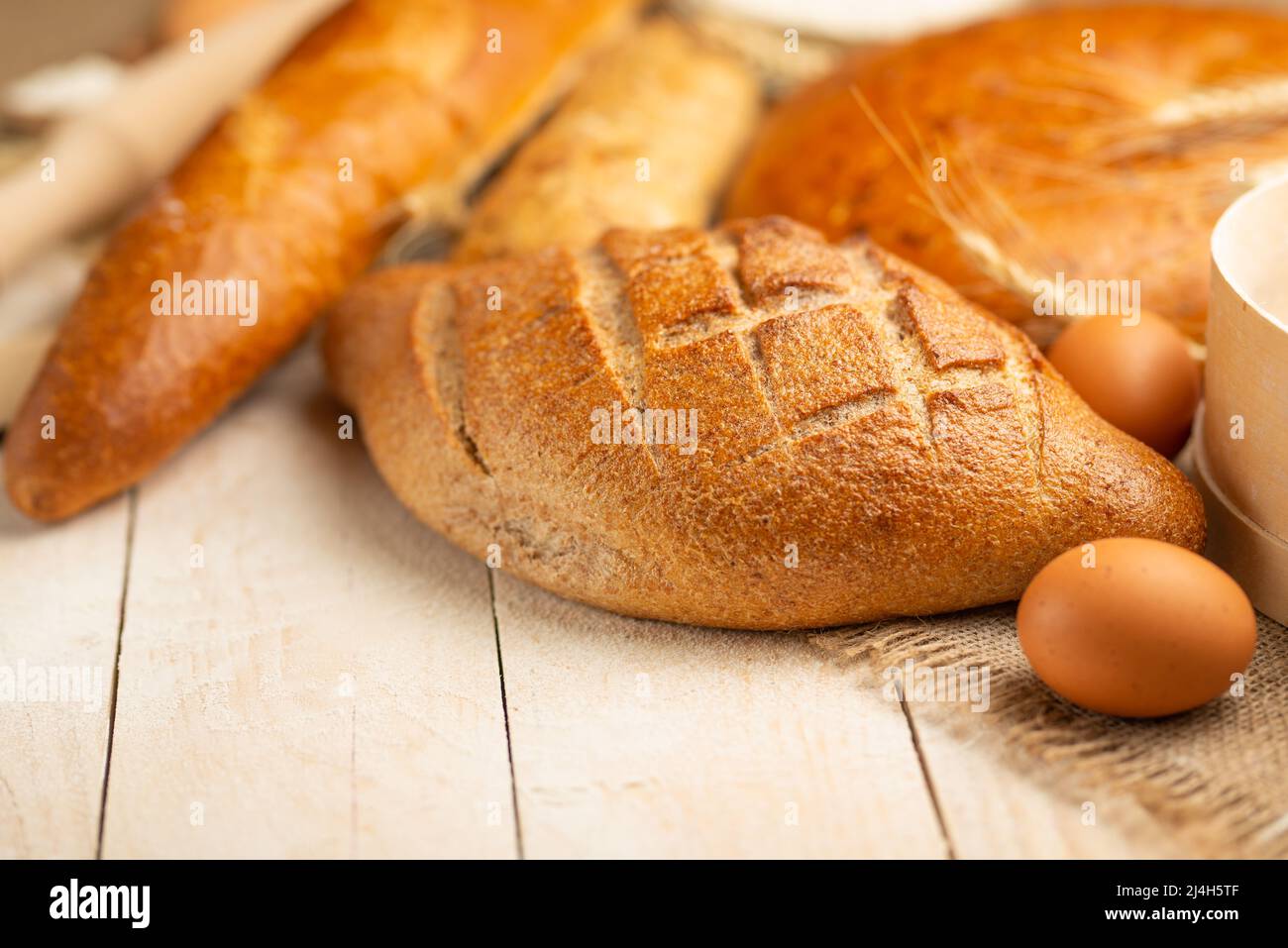 Bread border on a wood background with copy space. Brown and white ...