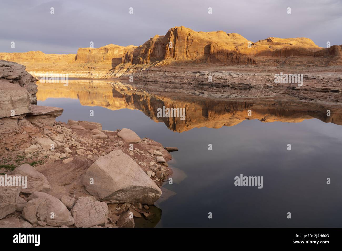 Cliffs rising above Lake Powell at sunset, Lake Powell, Glen Canyon ...