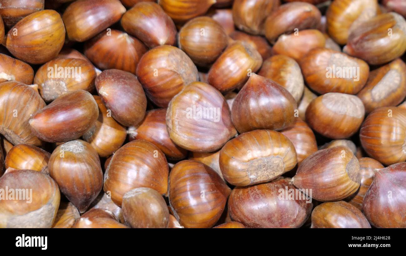 background of ripe brown hazelnuts in the supermarket Stock Photo - Alamy