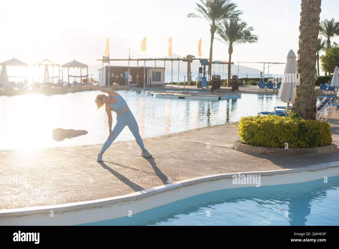 Woman star jump beach hi-res stock photography and images - Alamy