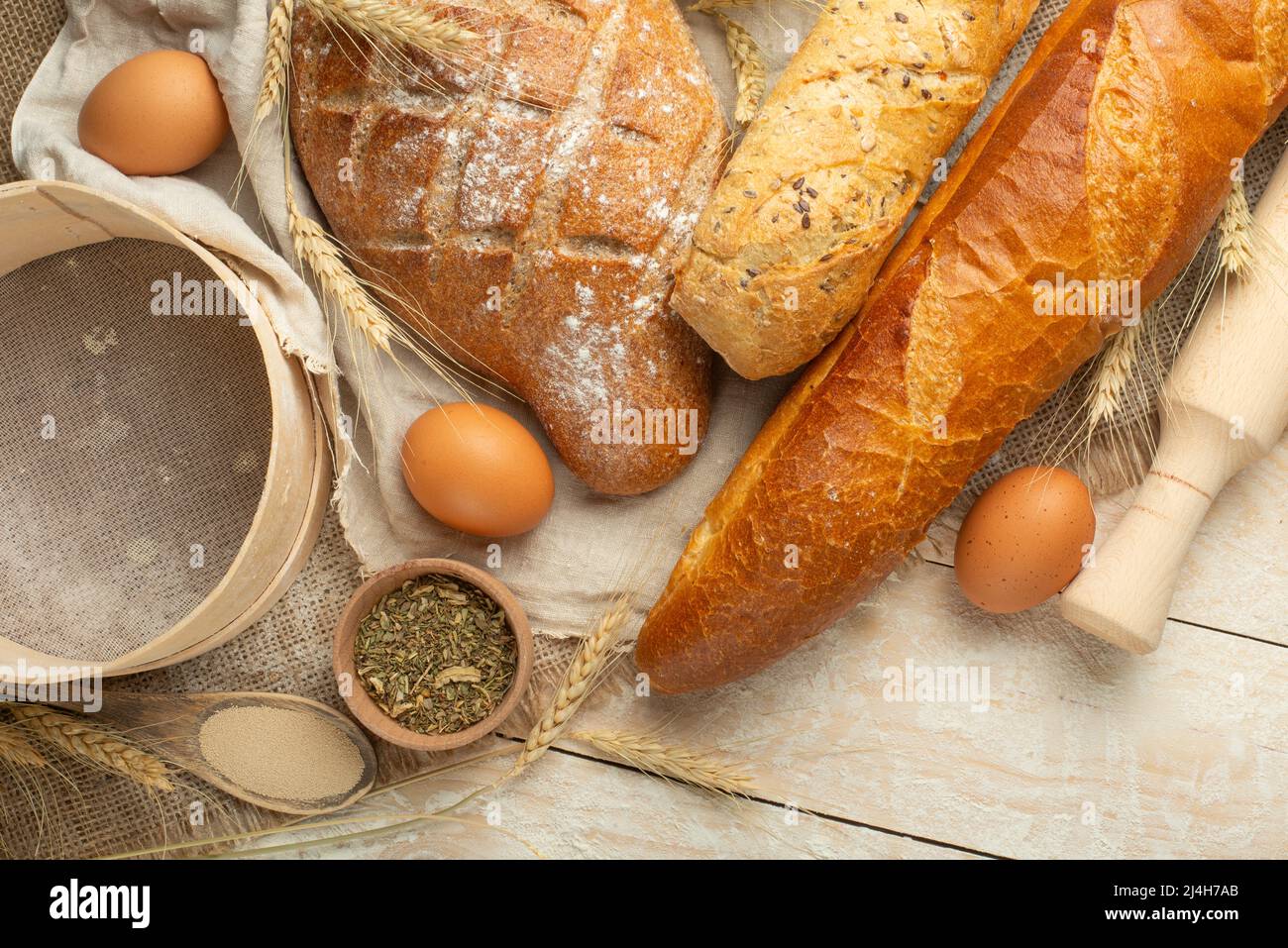 Bread border on a wood background with copy space. Brown and white ...