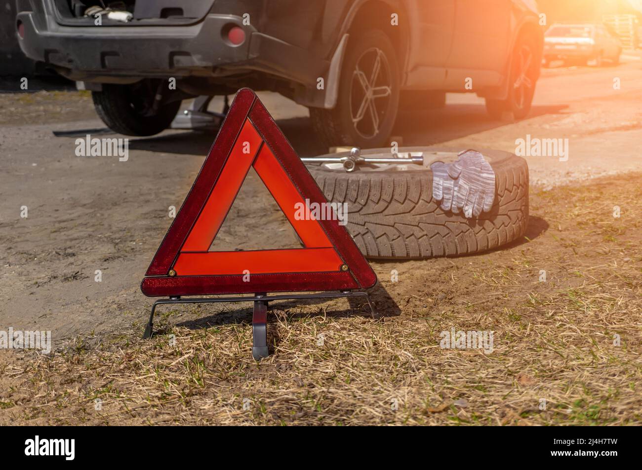 Red emergency stop sign warning sign of a red triangle and a broken car ...