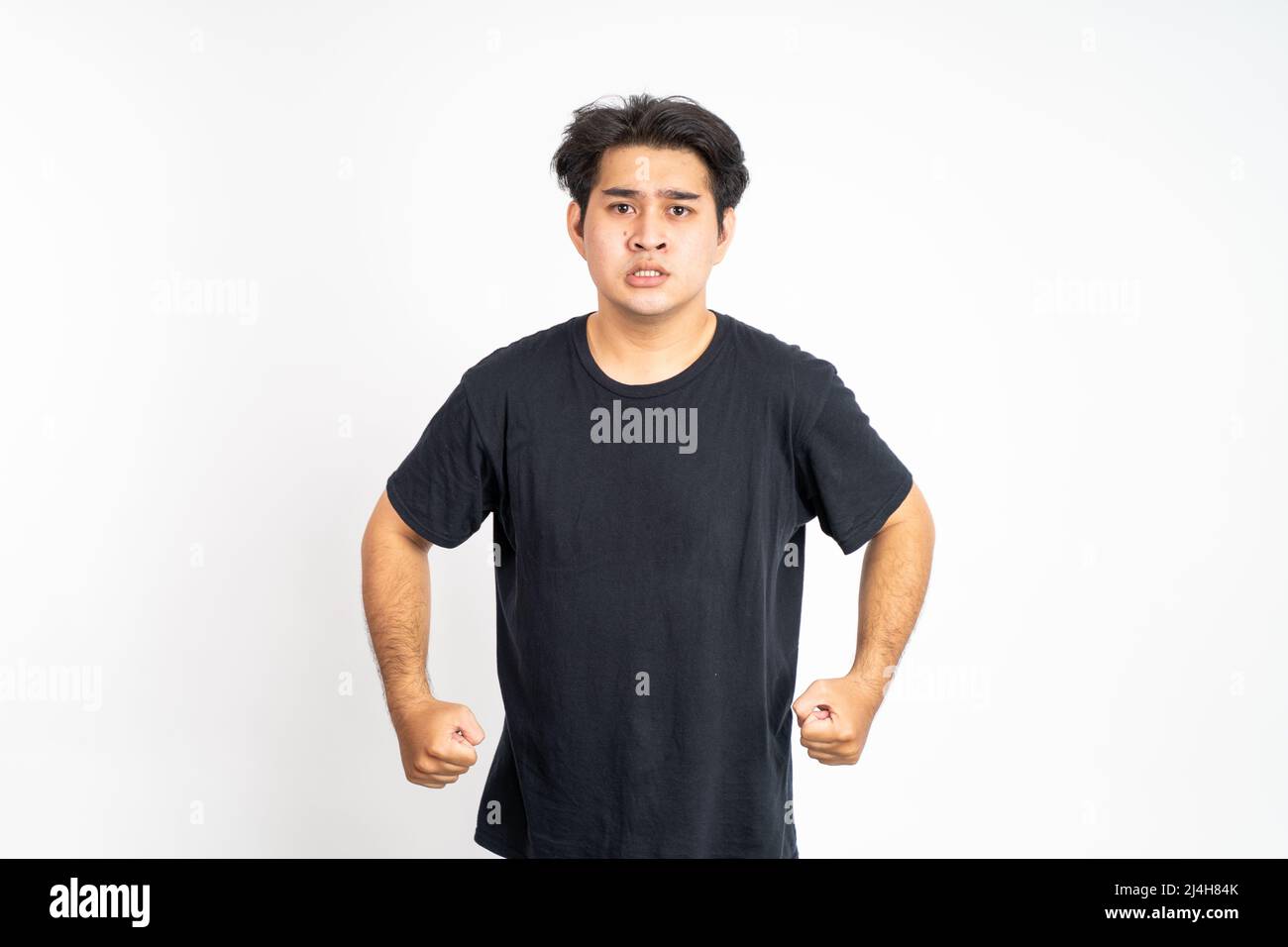 angry young man looking forward to camera Stock Photo - Alamy