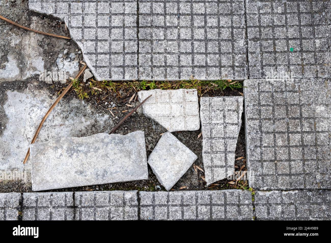sidewalk with broken and dirty tiles Stock Photo - Alamy