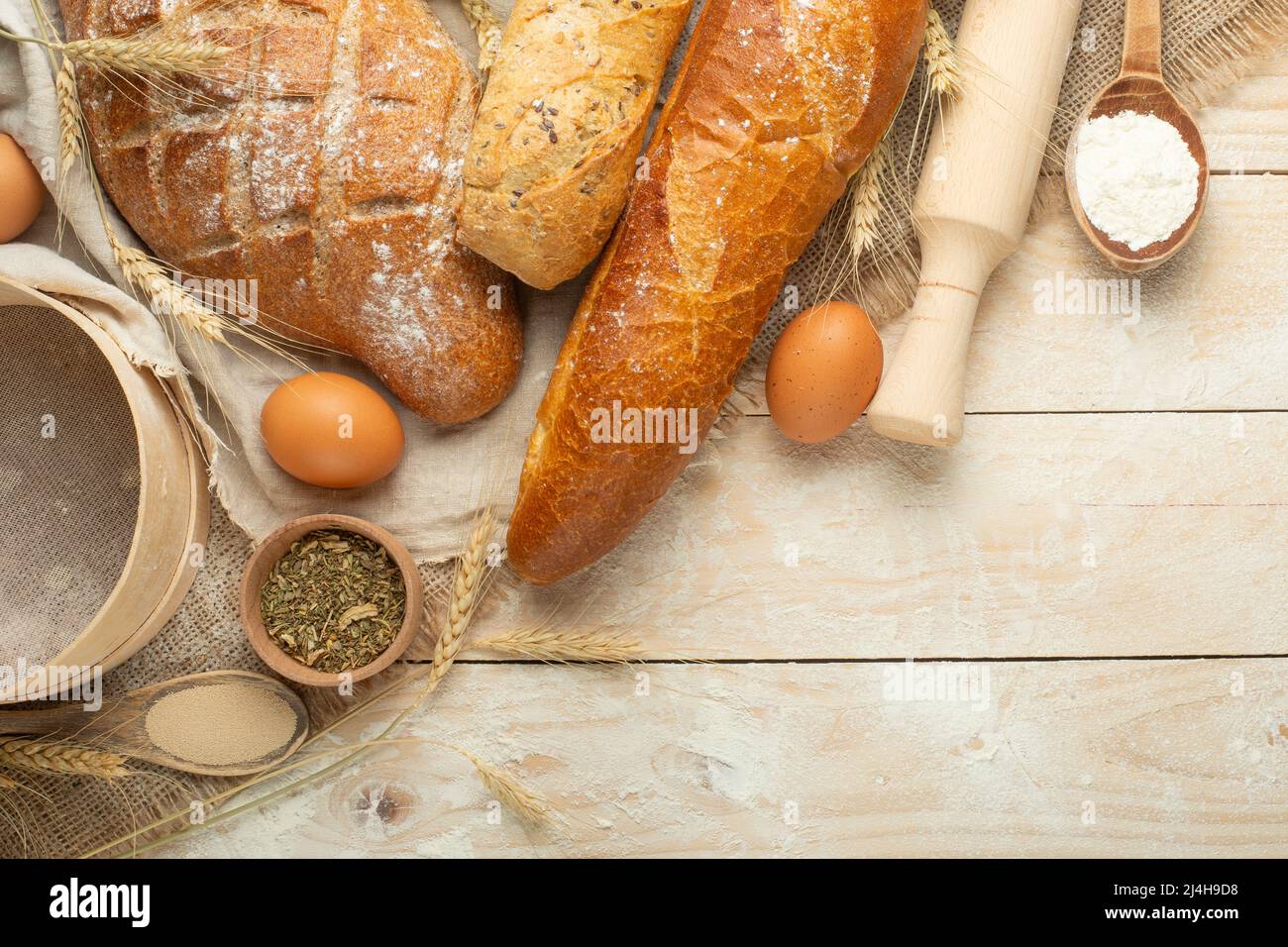 Bread border on a wood background with copy space. Brown and white ...