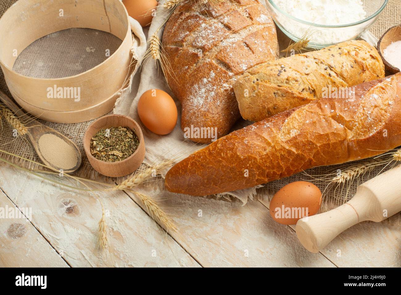 Bread border on a wood background with copy space. Brown and white ...