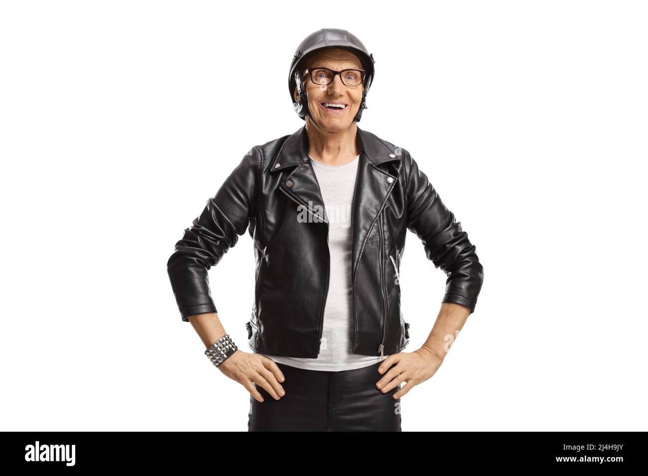 Elderly male biker with a helmet and leather jacket smiling at camera ...