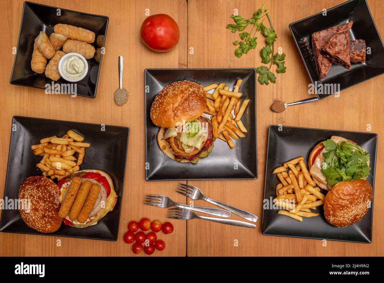 Set of fast food dishes and assorted beef burgers, meatballs with cream ...