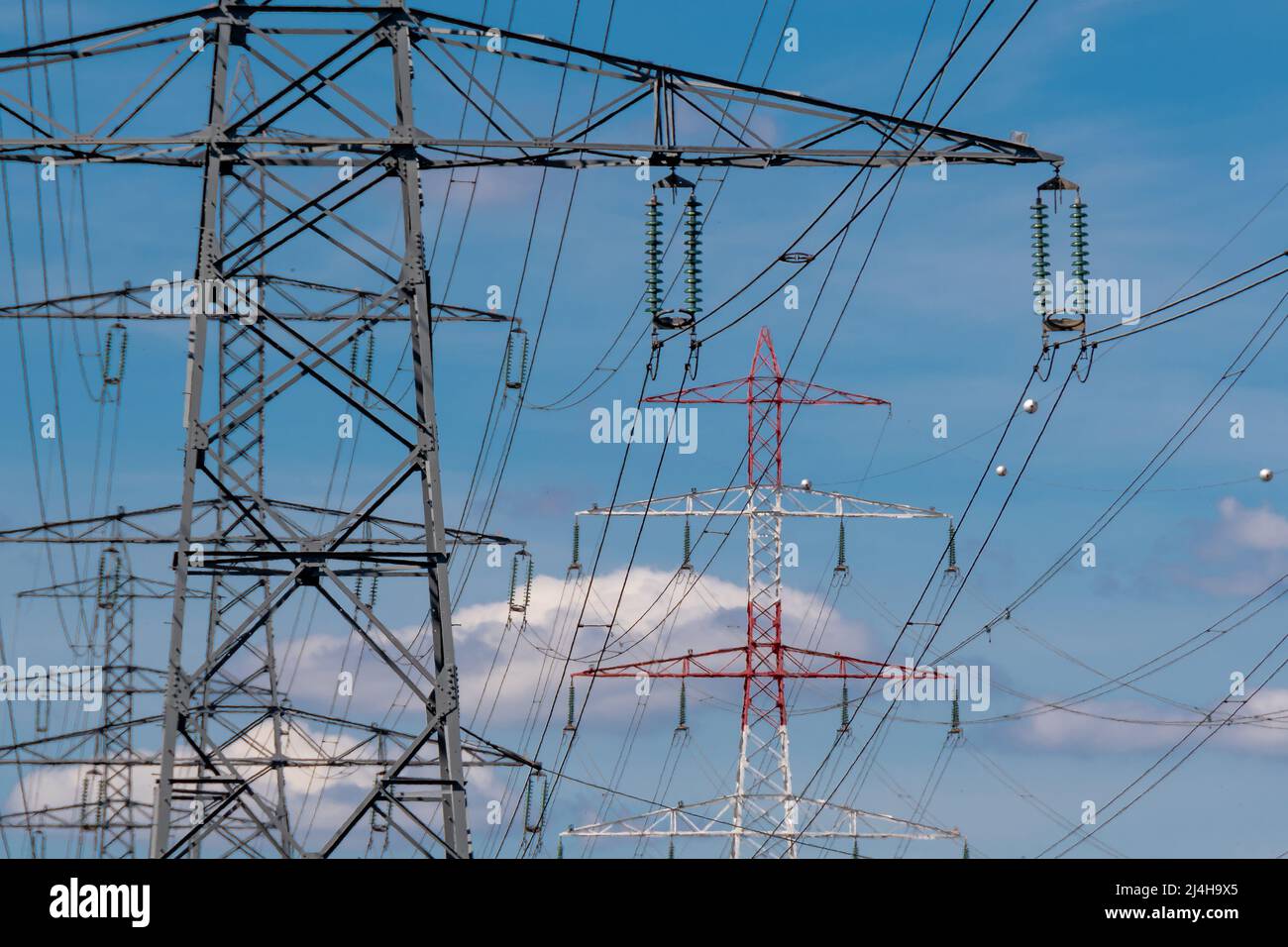 Metal pylons carrying overhead electric cables of high voltage lines ...