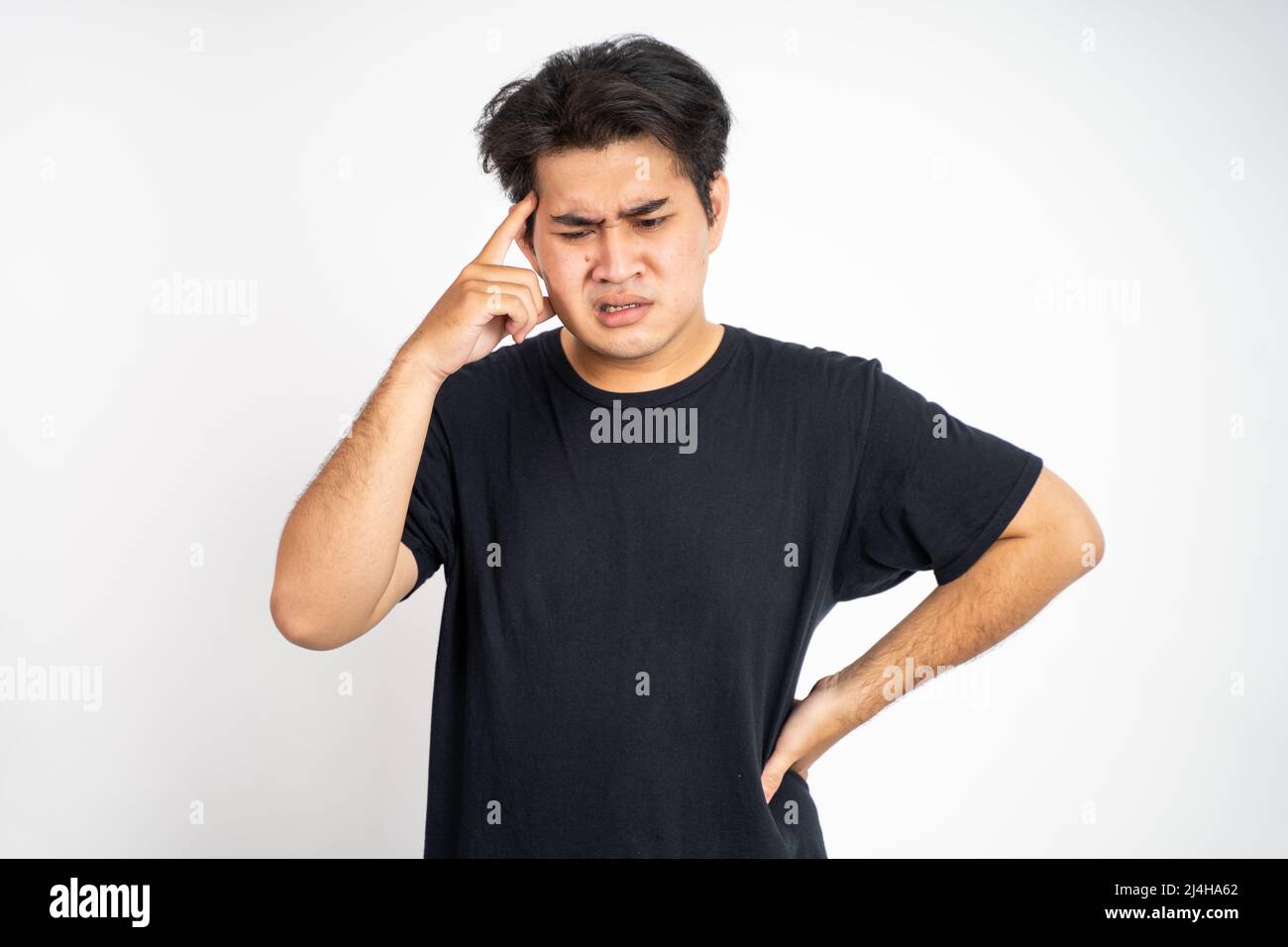Stressed asian young man feeling unsure about life Stock Photo - Alamy