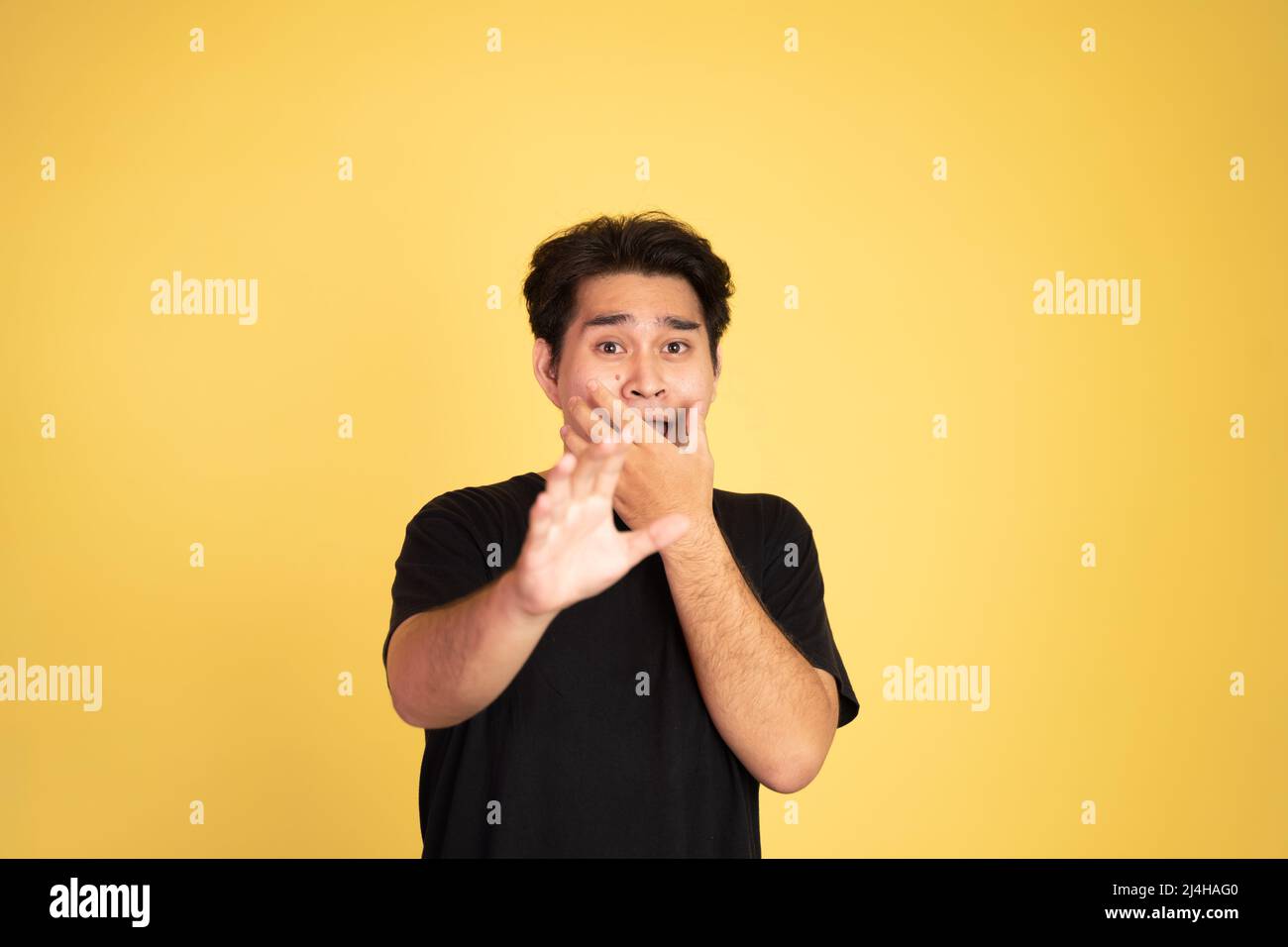 asian young man with scared gesture on isolated Stock Photo - Alamy