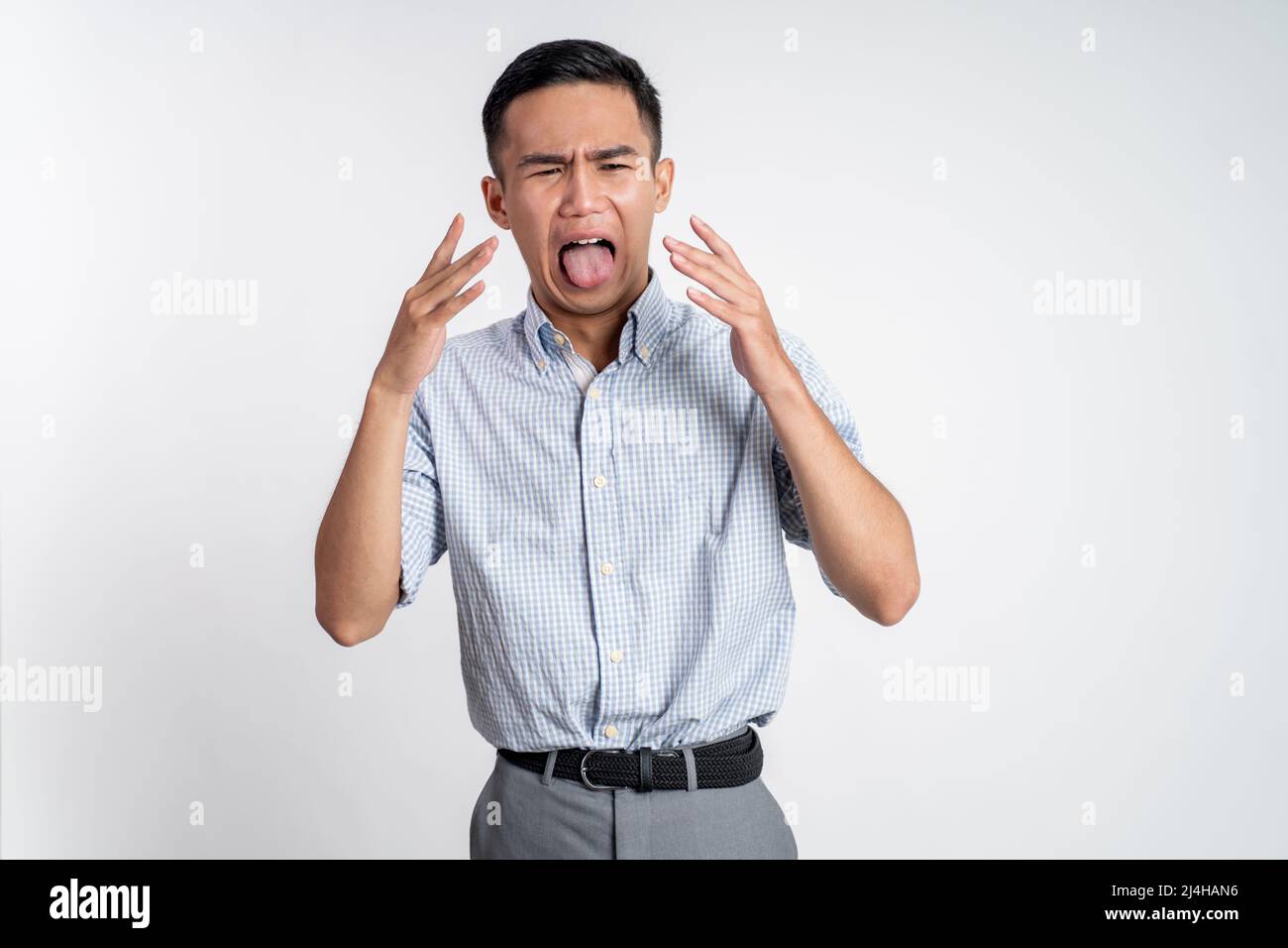 asian young man with disgusting expression isolated over white ...