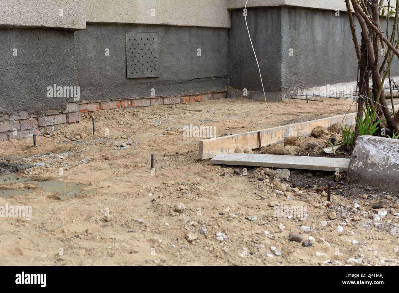 The process of building a blind area for the foundation of a house sand ...