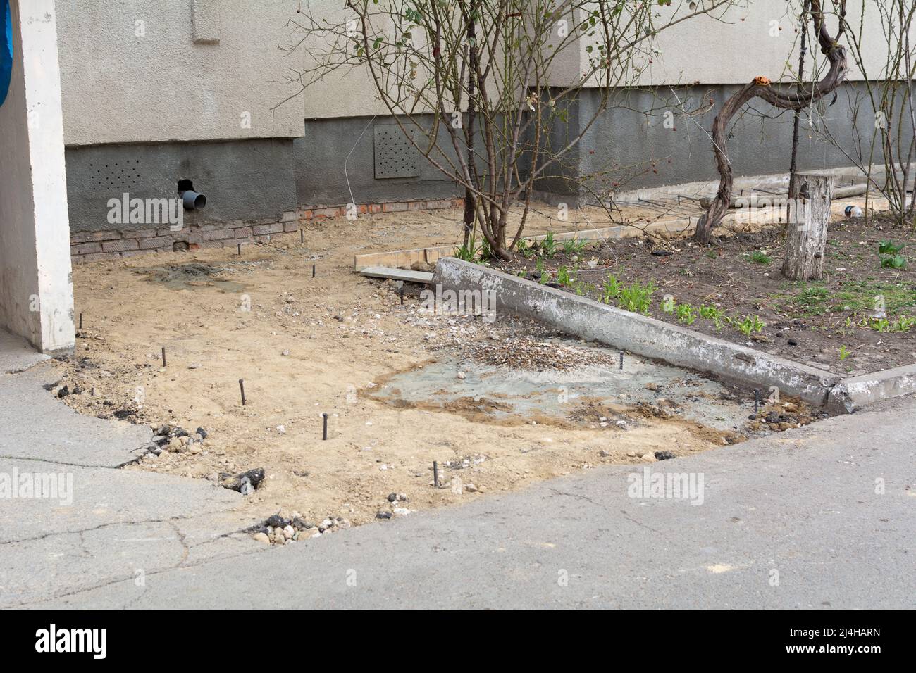 The process of building a blind area for the foundation of a house sand ...