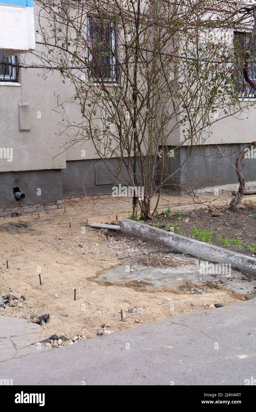 The process of building a blind area for the foundation of a house sand ...